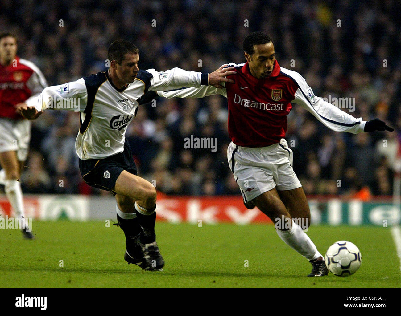 Arsenal's Thierry Henry and Liverpool's Jamie Carragher in action ...