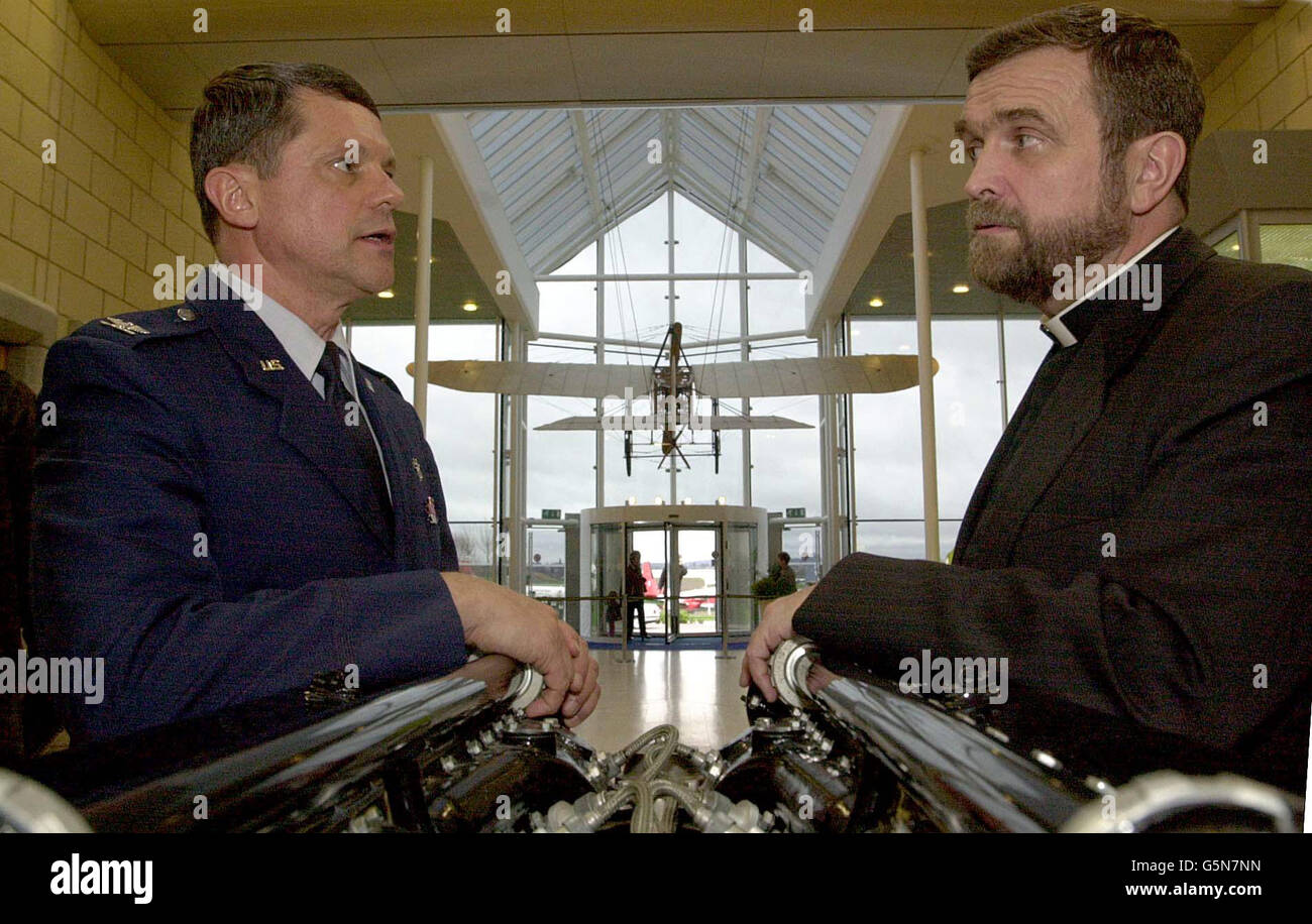Chaplain of the Fleet Rev. Simon Golding (right) discusses the ...