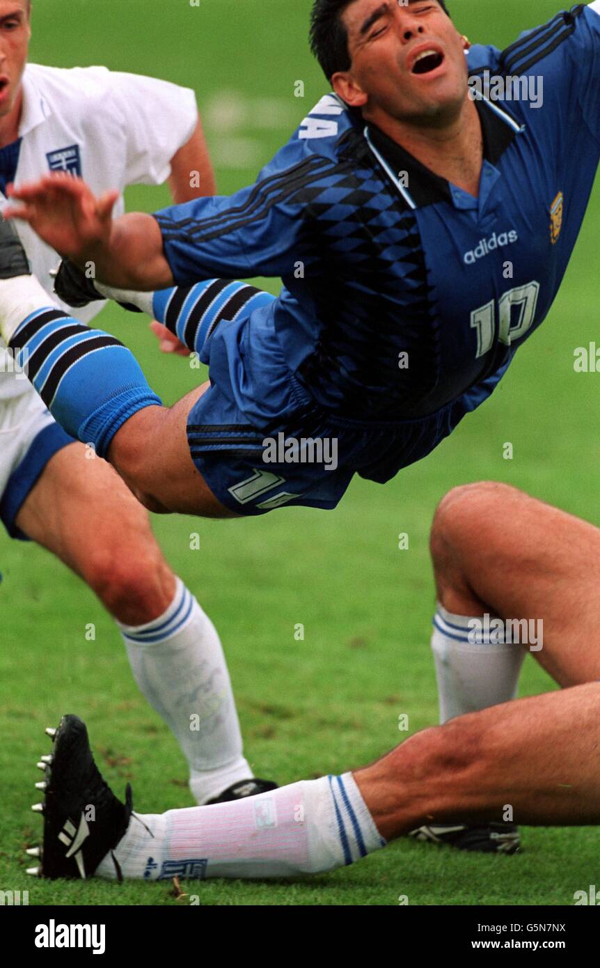 Argentinas diego maradona theatrically dives over a sliding tackle hi ...