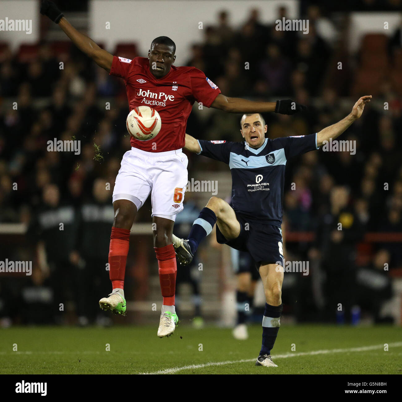 Nottingham Forest's Guy Moussi and Burnley's Dean Marney Stock Photo ...