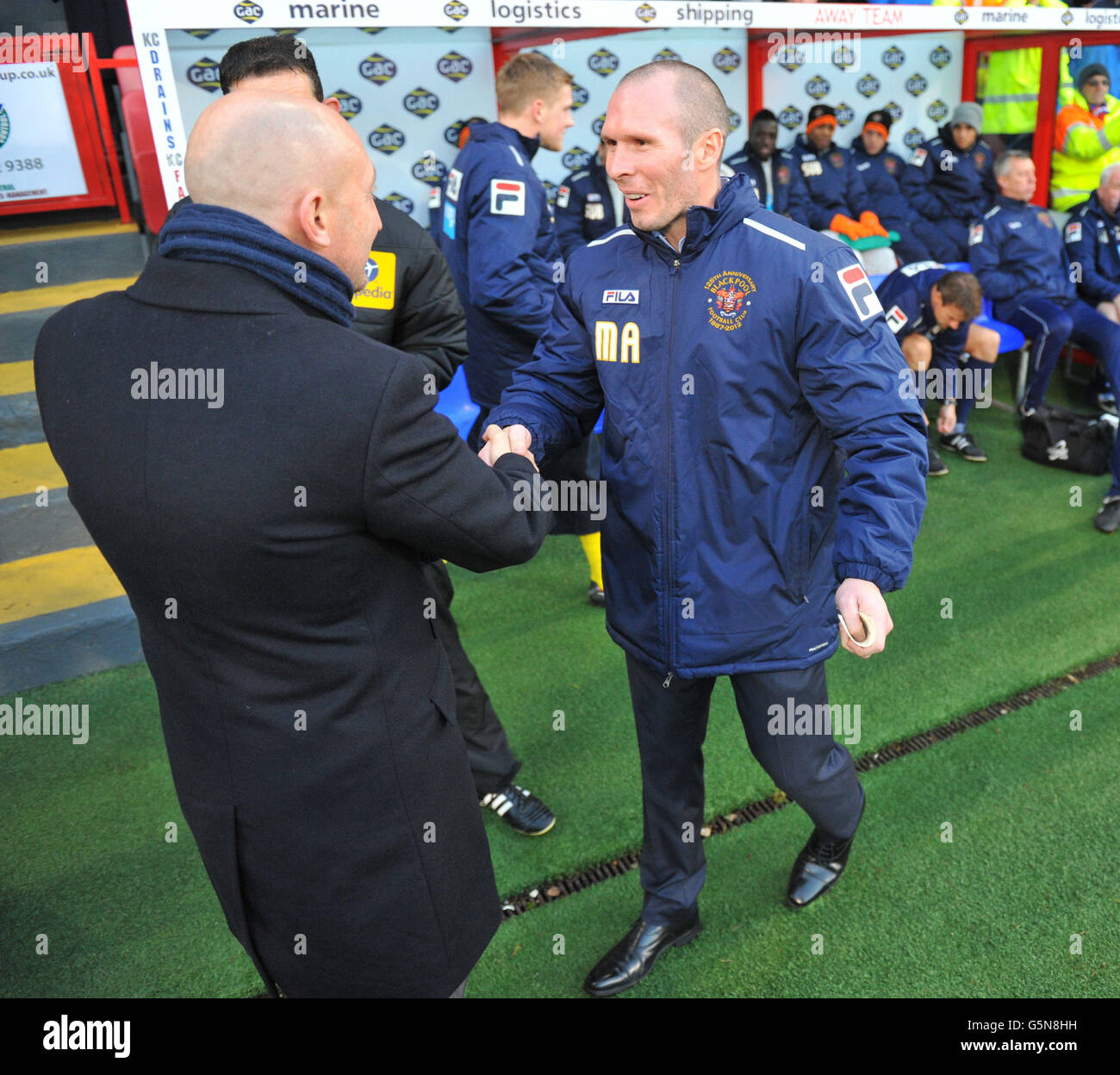 Blackpool's manager Michael Appleton (right) greets Crystal Palace's ...