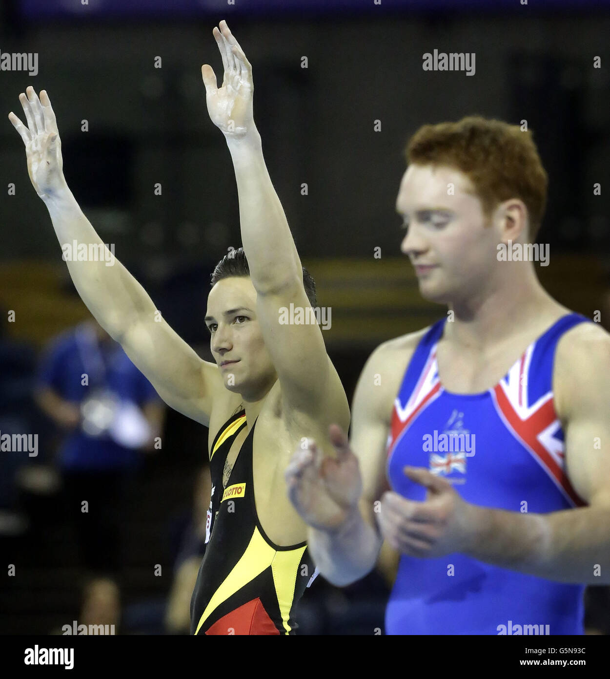 Marcel Nguyen (left) celebrates his gold with bronze medal winner ...