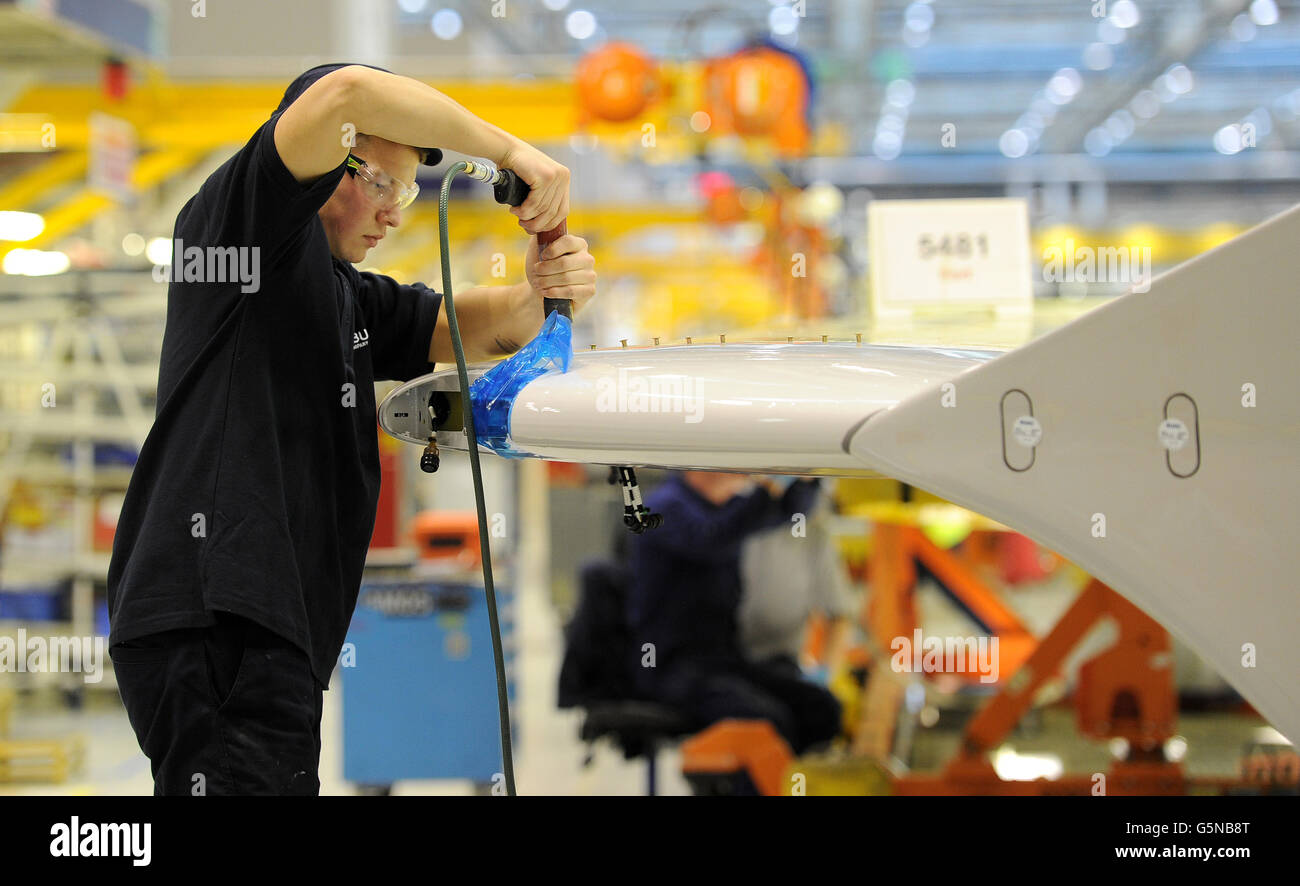 Engineers work on the wings for the Airbus A320, a Airbus UK in ...