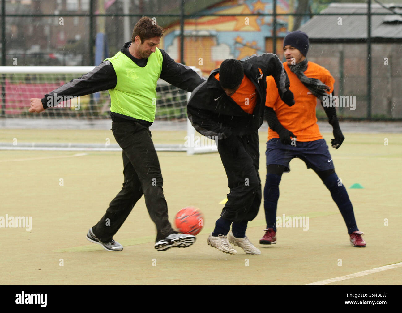 Actor Gerard Butler takes part in a Street League charity football 5-a ...