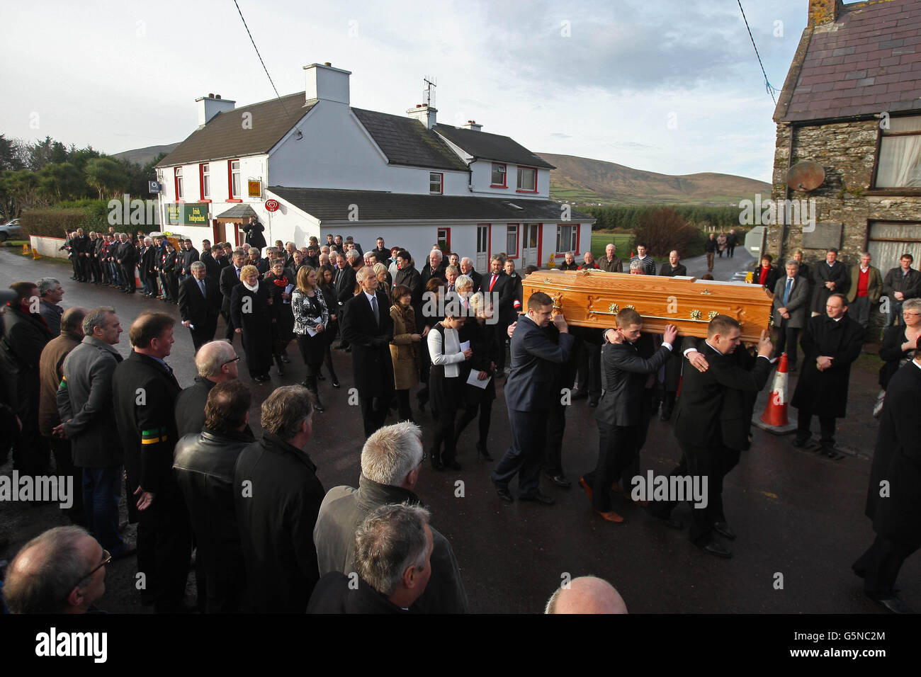 The coffin of former gaelic footballer Paidi O Se is brought through ...