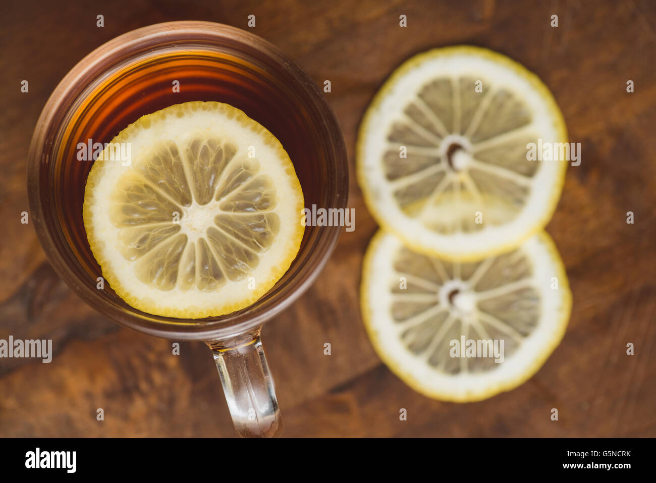 Top view of black tea with lemon in cup and on wooden plank table Stock ...