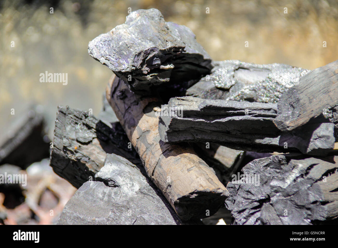 Photograph of some wood charcoal pieces and fire flames Stock Photo - Alamy