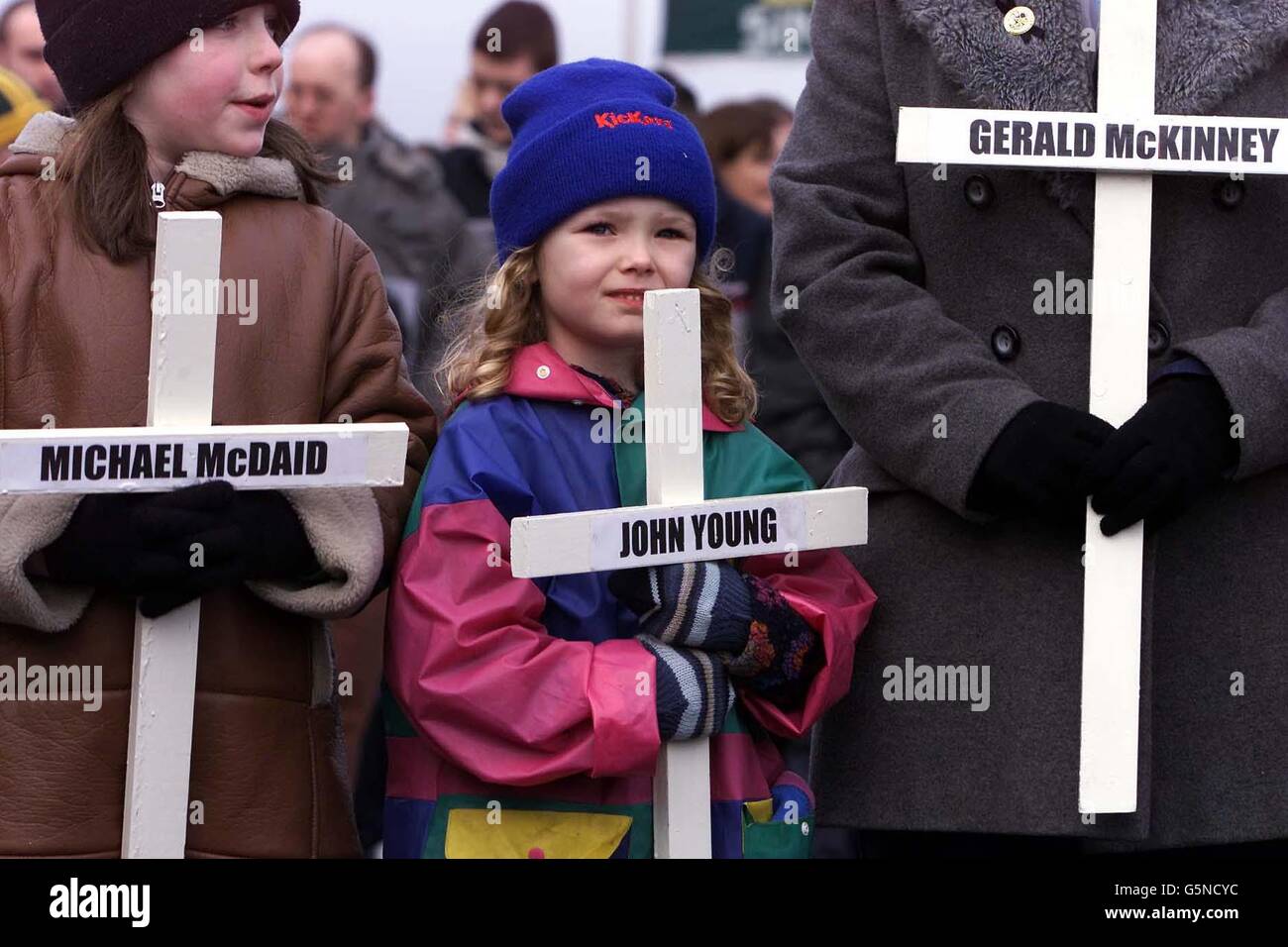 Judith Walker, ten (left ), and Annie Ward, six carrying crosses for ...