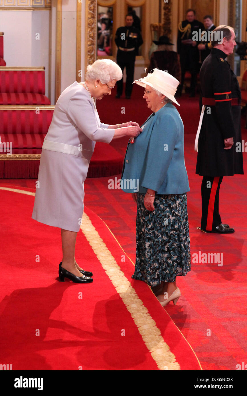 Is made a cbe by the queen at buckingham palace hi-res stock ...