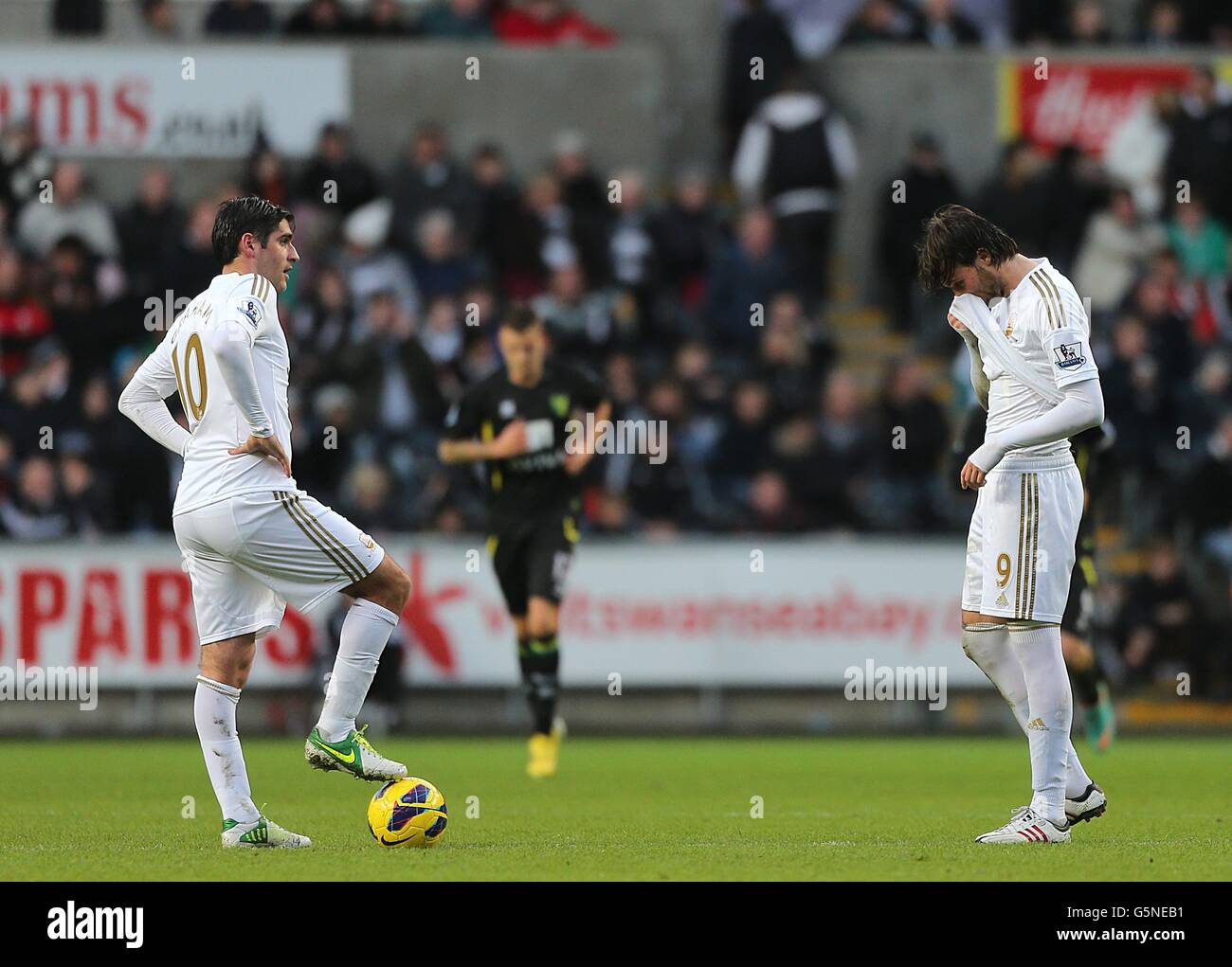 Swansea City's Miguel Michu (right) and Danny Graham stand dejected ...