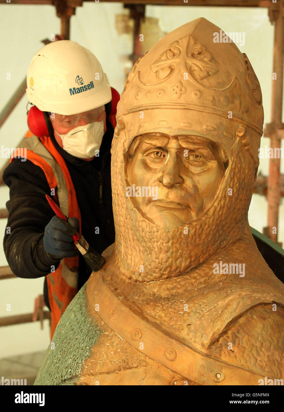 David Oakes from Mansell Construction sweeps dust from the statue of ...