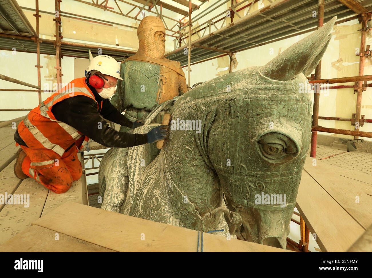 David Oakes from Mansell Construction sweeps dust from the statue of ...