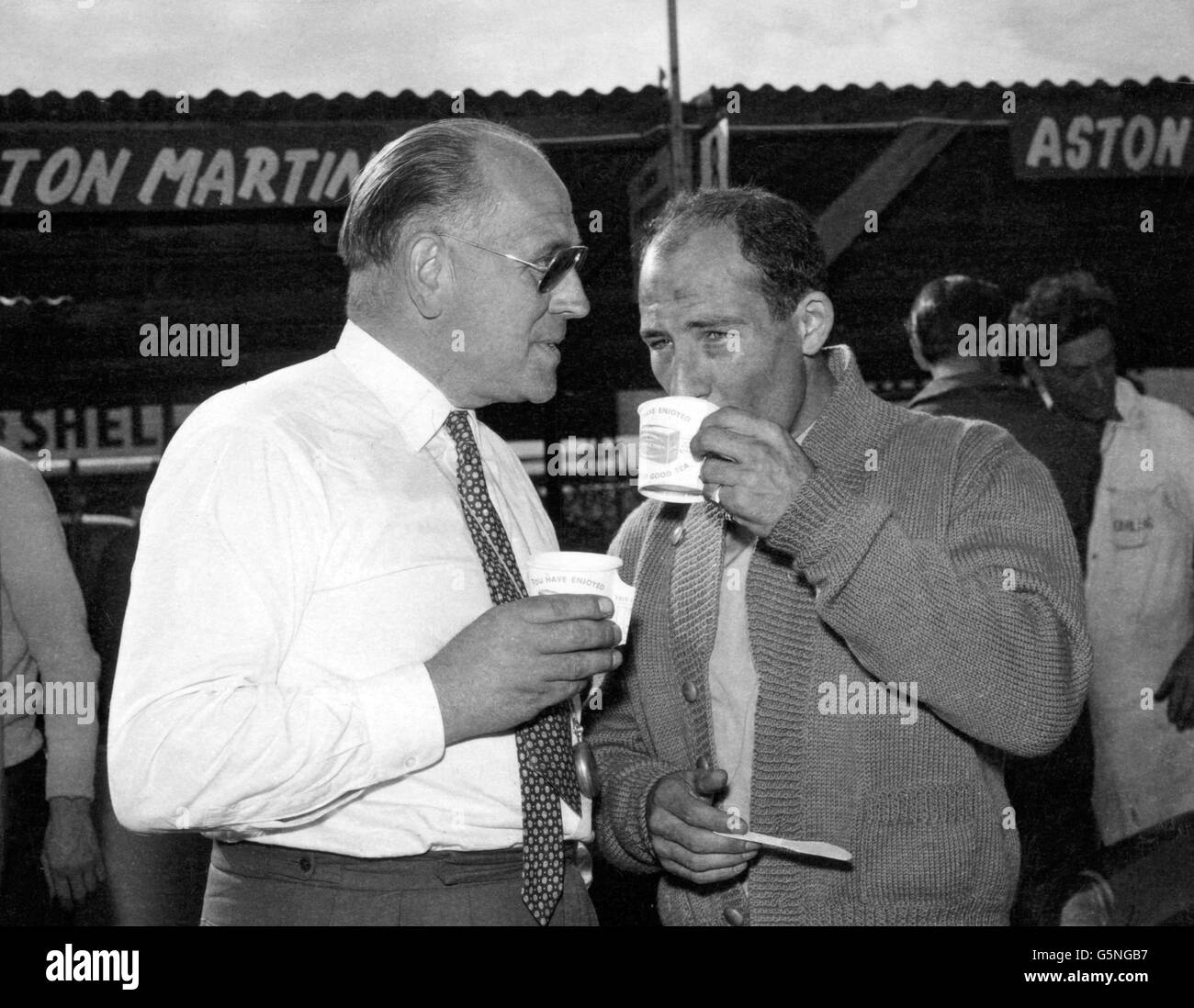 Stirling Moss (right) talks to Aston Martin team manager Reg Parnell ...