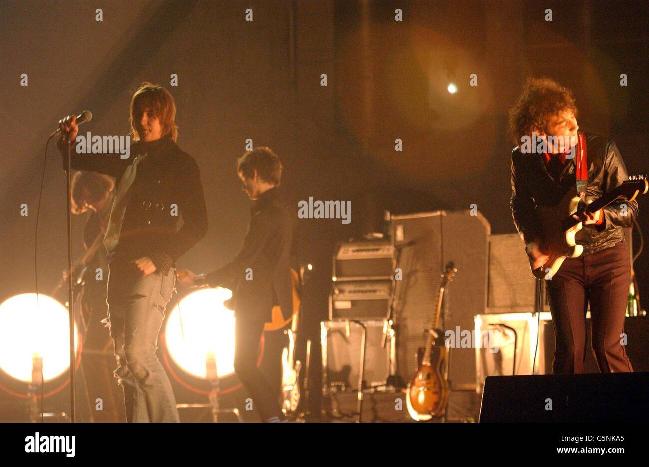 Celebrity pop stars bands performing live music microphone awards brits ...