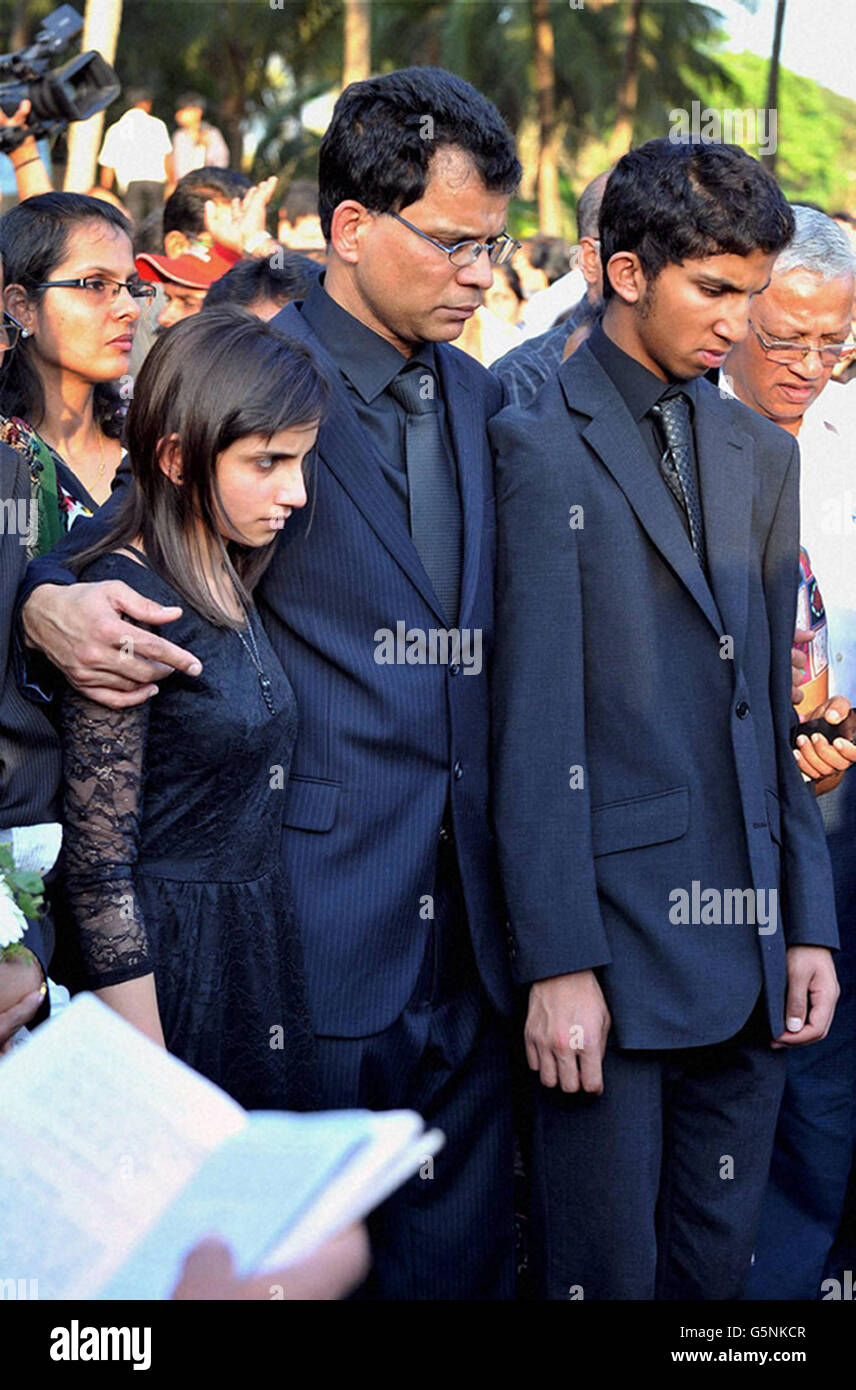 Husband Benedict Barboza, holds his son Junal, and daughter Lisha ...