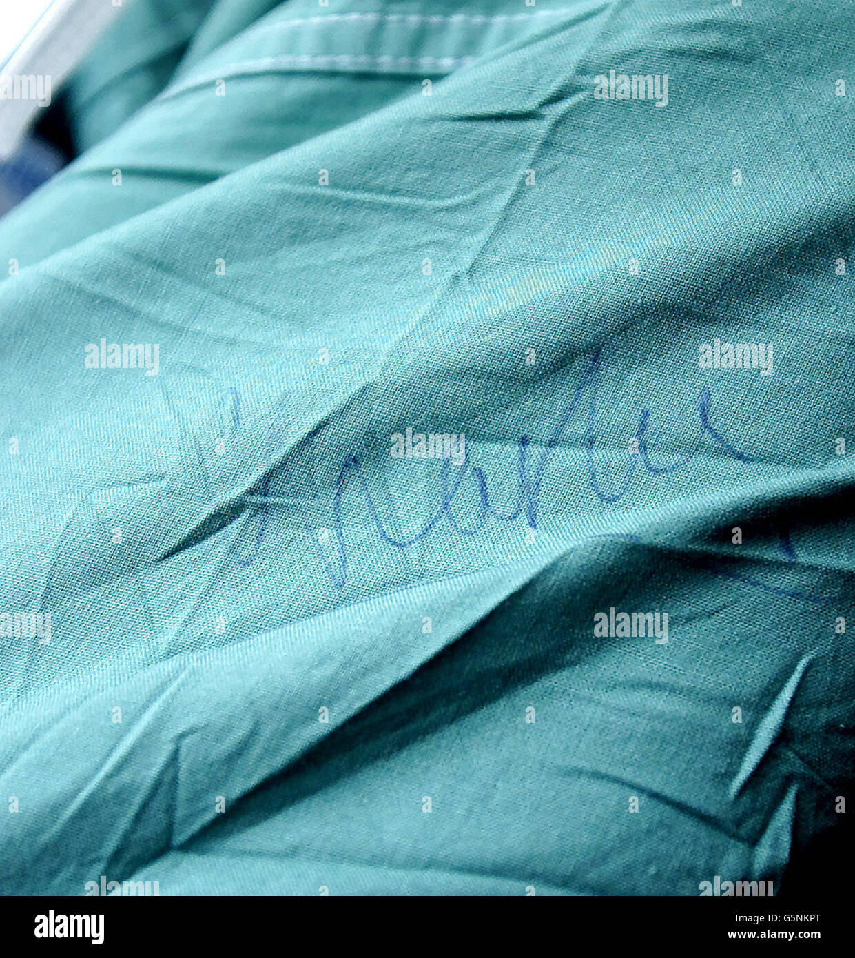 Nurse Karla Graham shows off the autograph of the Prince of Wales, who ...