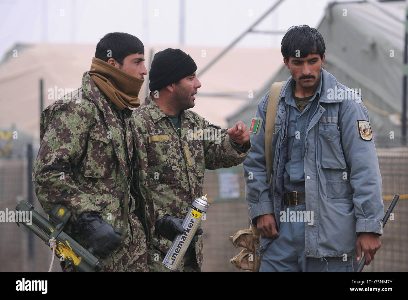 Sergeant Waysidin (centre) teaches members of the Afghan National Army ...
