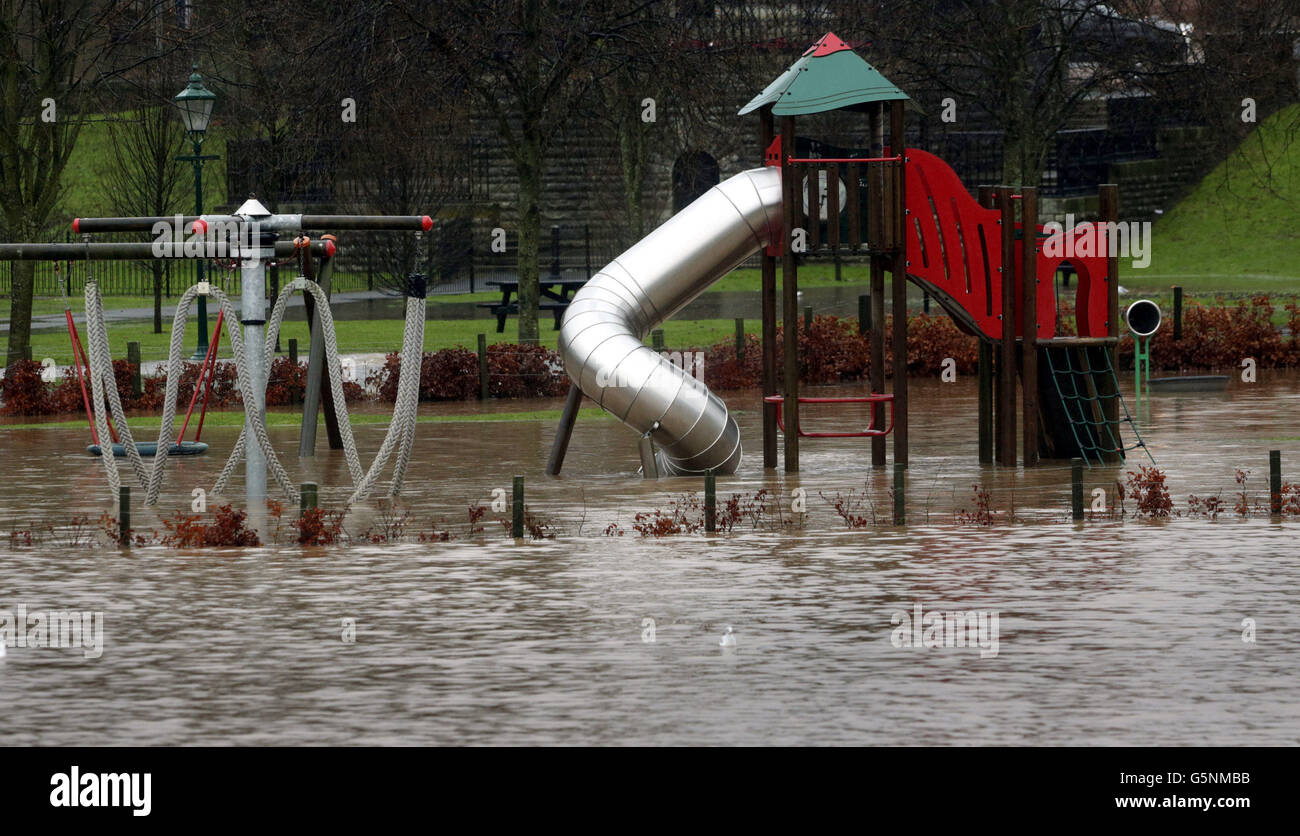 Children's play equipment sits in flood water in Cupar, Scotland, after ...