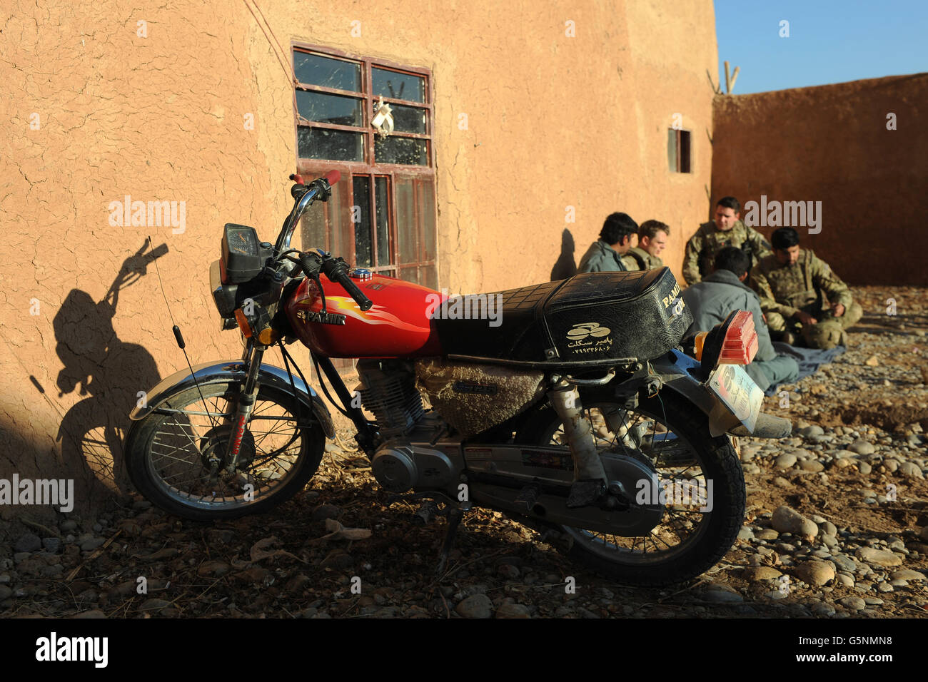 Motorbikes sits at checkpoint Chara-He as British forces hold a meeting ...