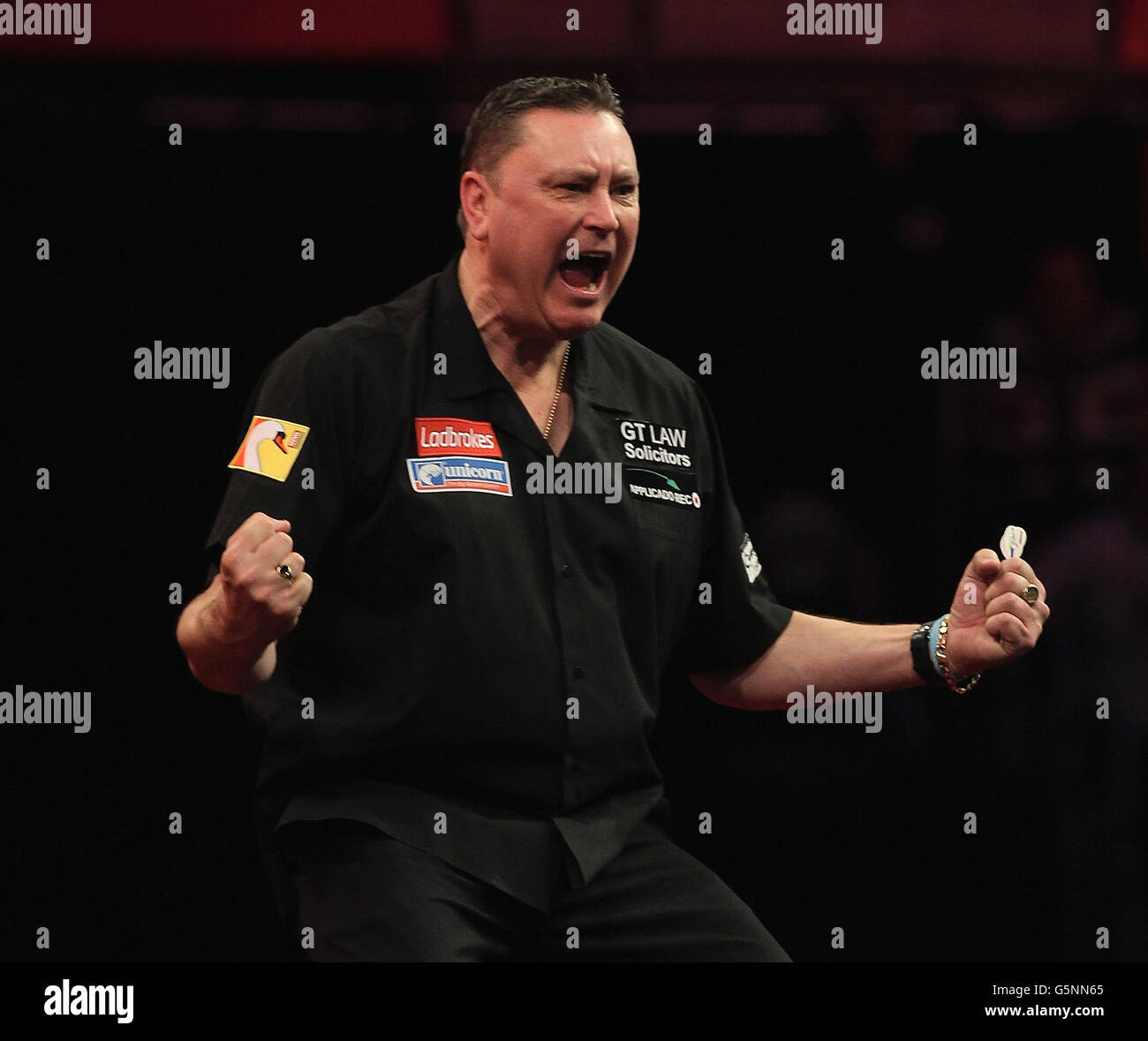 Kevin Painter celebrates winning over Ronnie Baxter in the Second Round ...