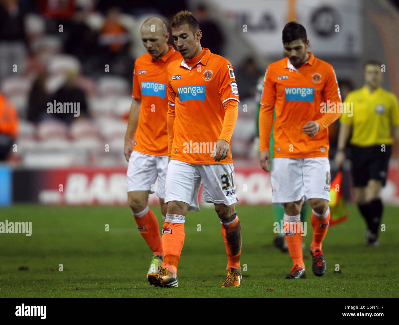 Blackpool's Martinez Cervera Angel (centre) walks off the pitch with ...