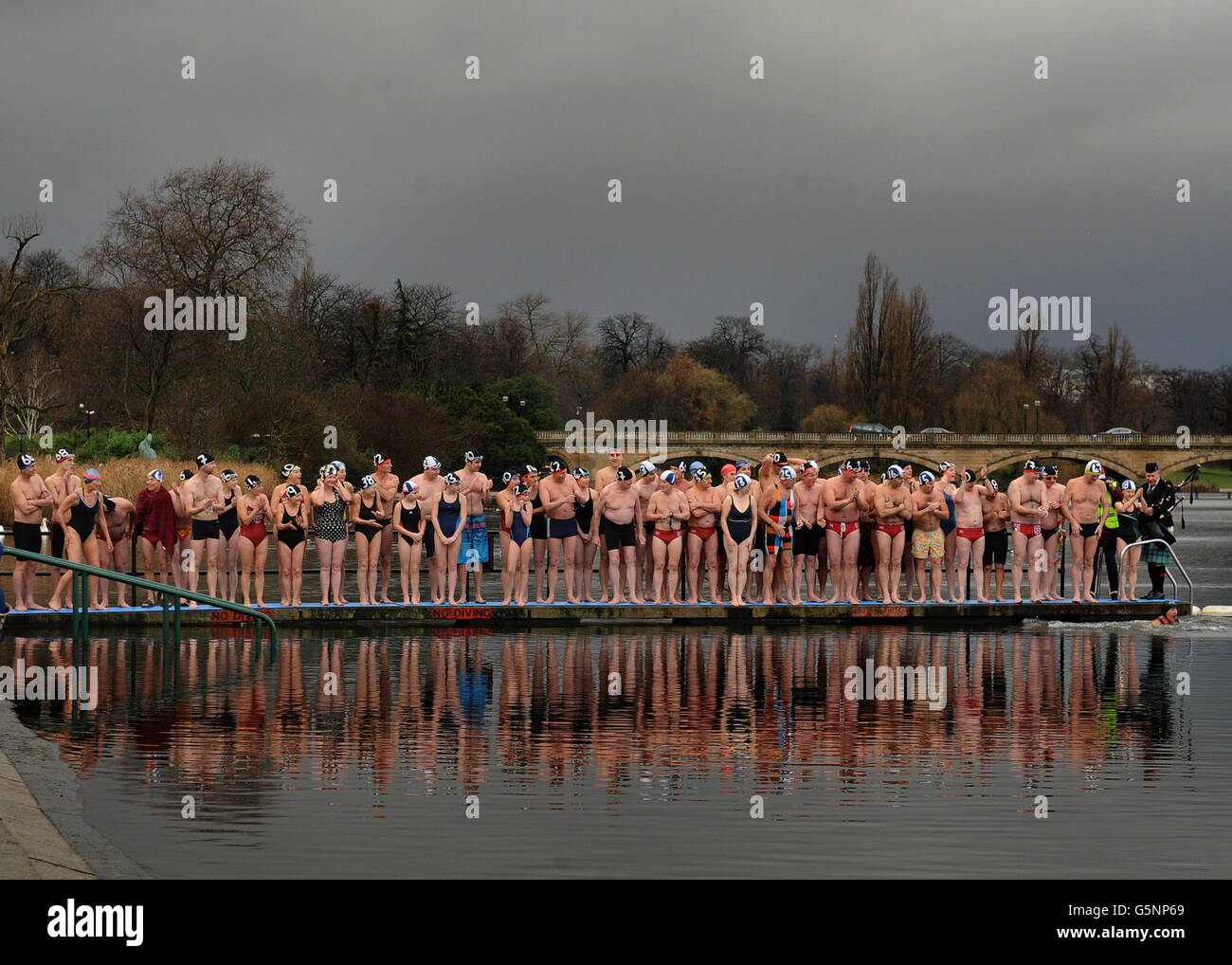 A piper plays as the first members of the Peter Pan club enters the ...