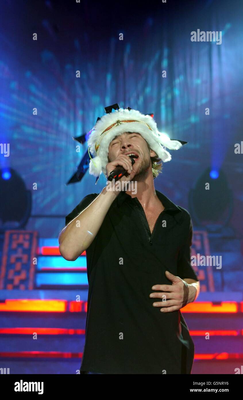 Jamiroquai frontman Jay Kay performing on stage at London's Wembley ...