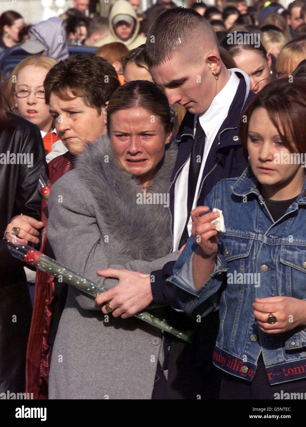 Family members and friends of Debbie McComb, 16, at her funeral. The ...
