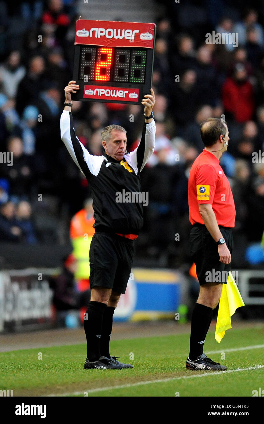The fourth official holds up an electronic board signalling how much ...