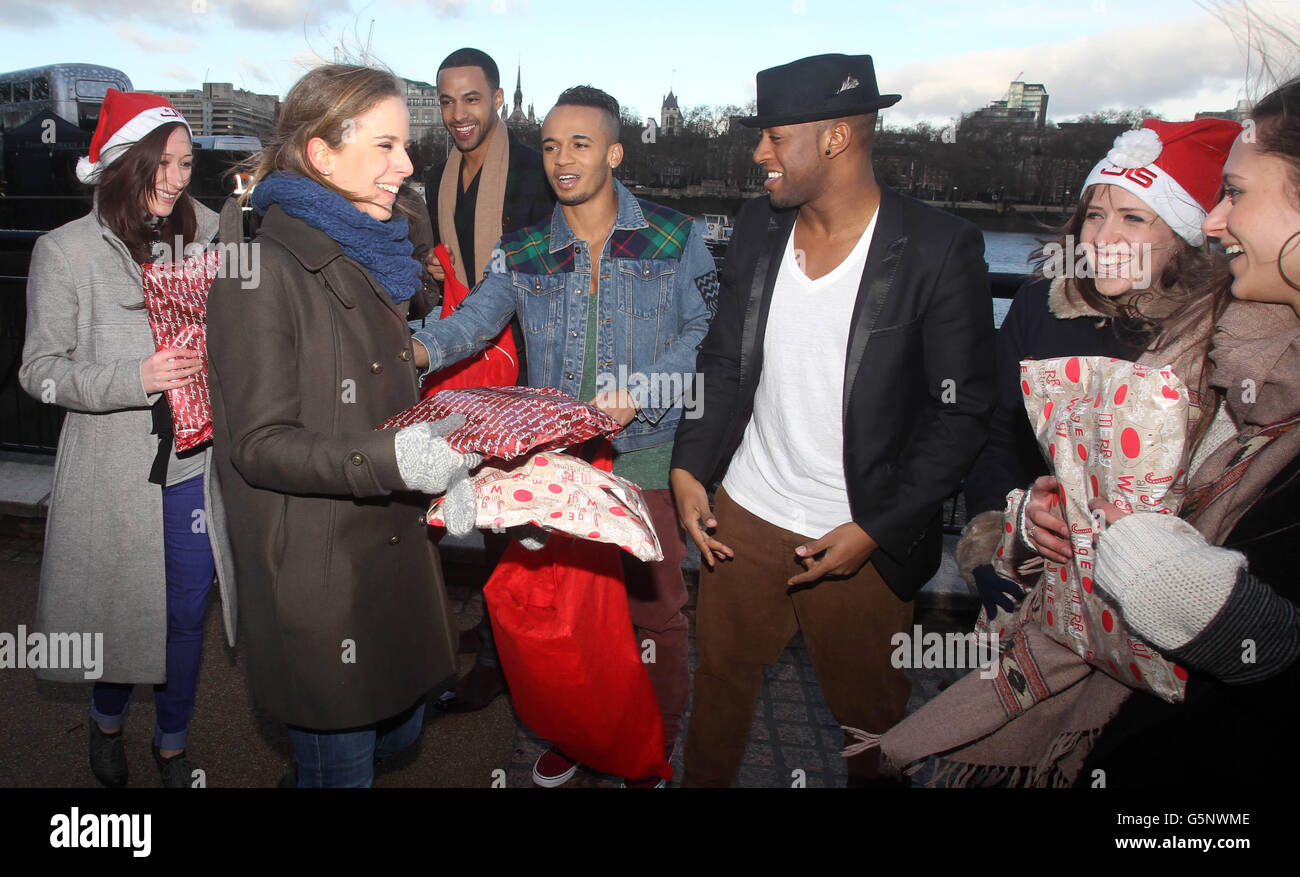 JLS hand out Christmas presents to fans on the South Bank in London as ...