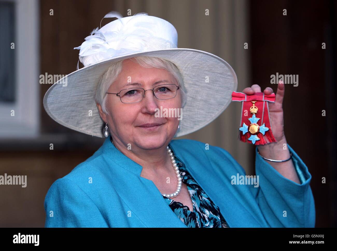 Professor Kathleen McCourt with her CBE following an Investiture ...