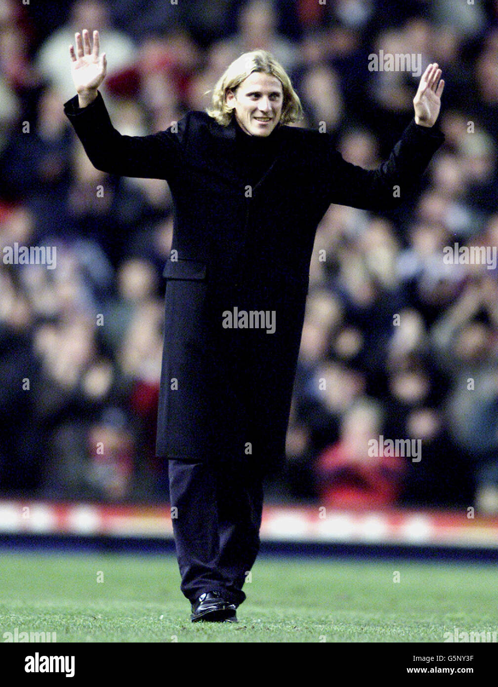 Manchester United's new player Diego Forlan walks around the ground ...