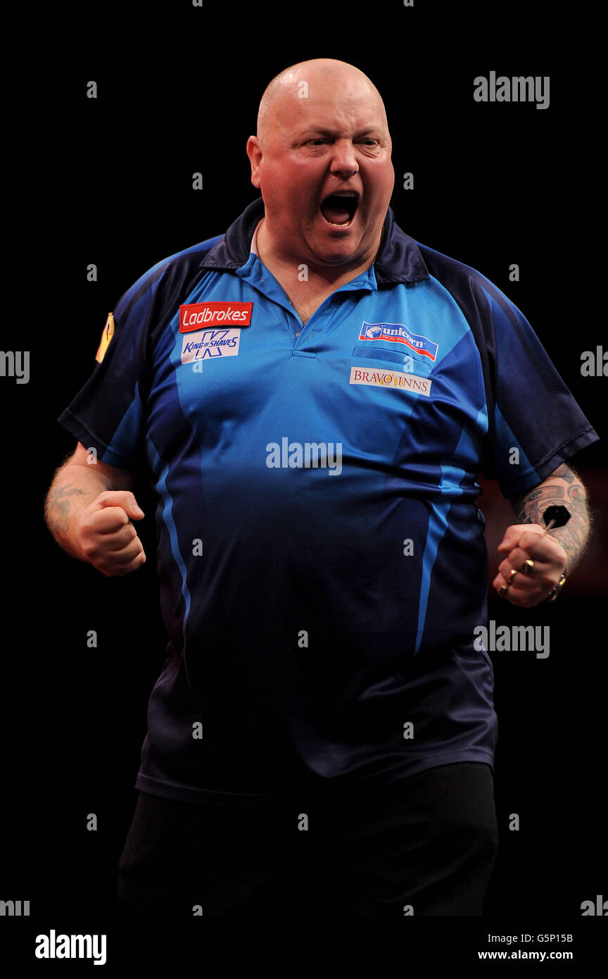 England's Andy Hamilton celebrates winning a leg during his First Round ...