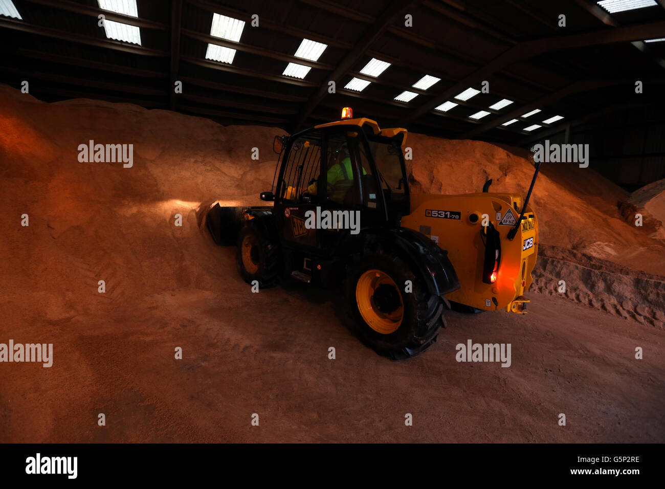 Richard Lilley who works for contractor May Gurney prepares salt to be ...