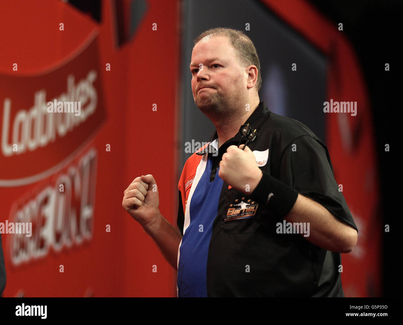 Raymond van Barneveld celebrates winning against Brendan Dolanin in the ...