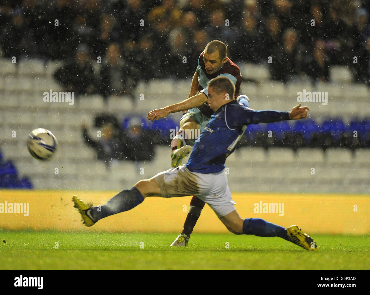 Birmingham City's Mitch Hancox tries to block Burnley's Dean Marney's ...