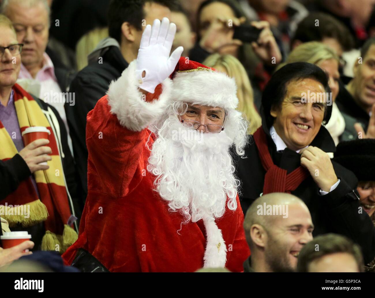A Liverpool fan dressed in Santa Claus fancy dress in the stands Stock ...