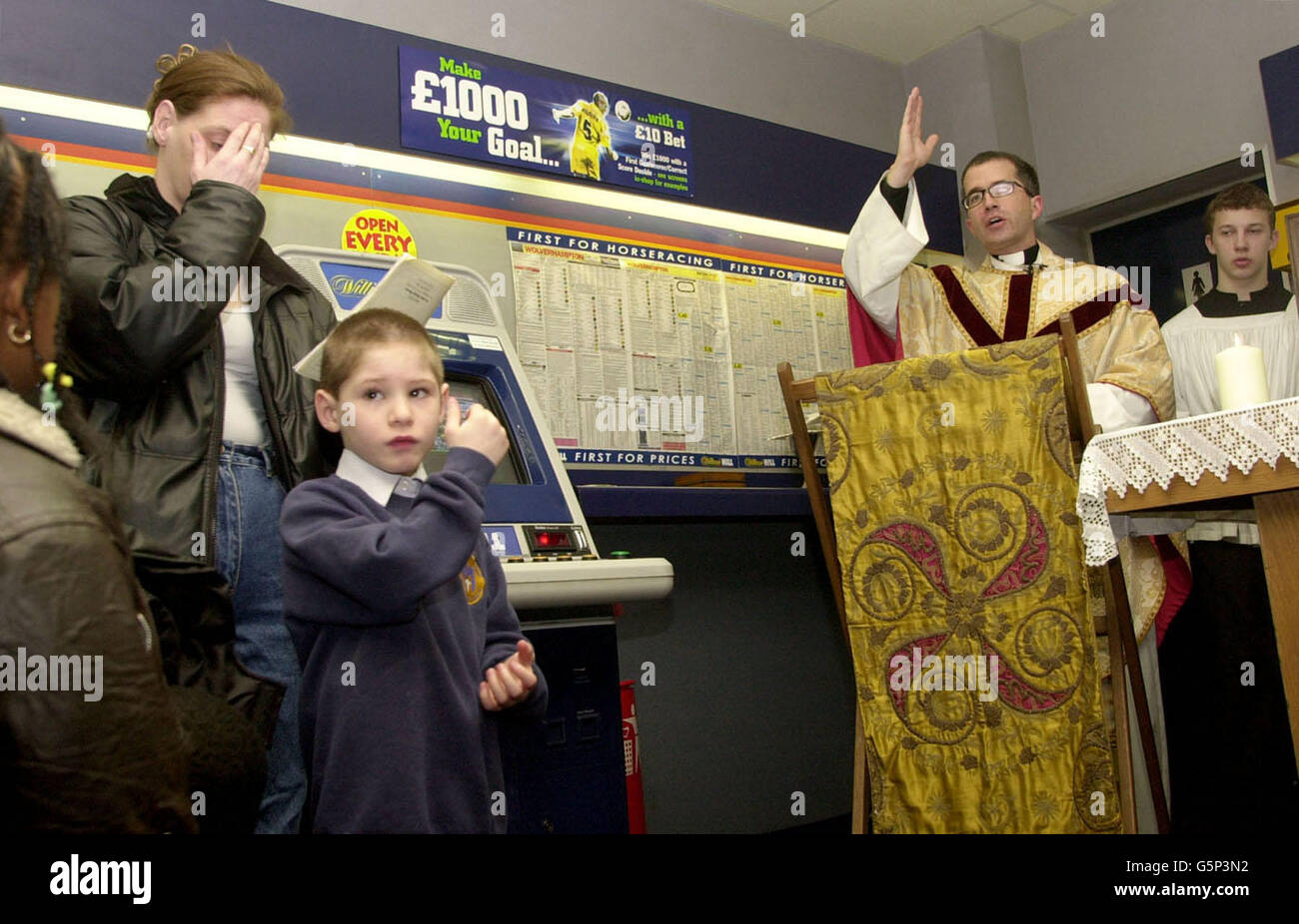 The Reverend Nicholas Wheeler (right) takes an early morning service ...