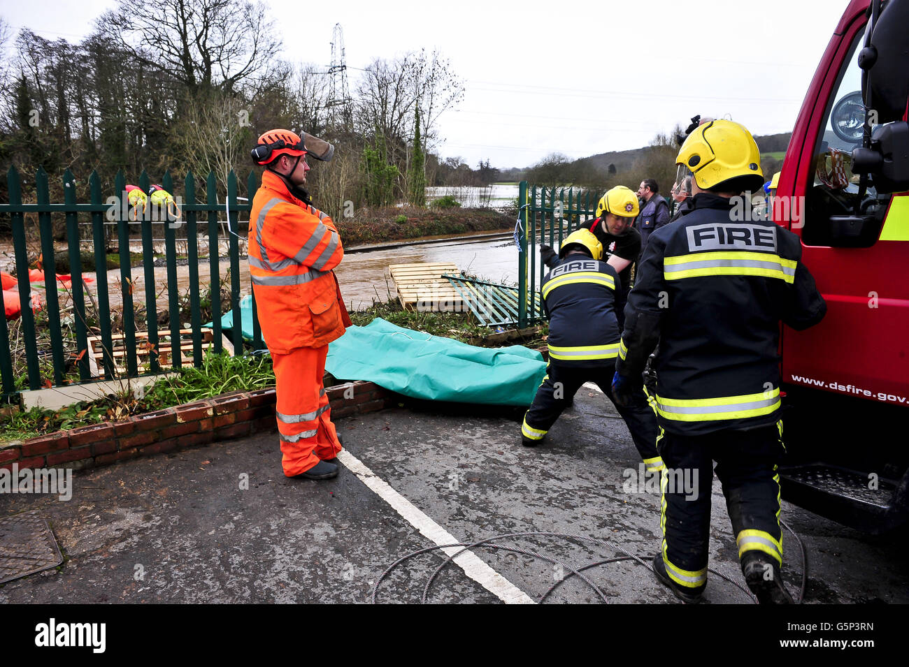 Railway engineers and Fire and Rescue service personnel retrieve an ...
