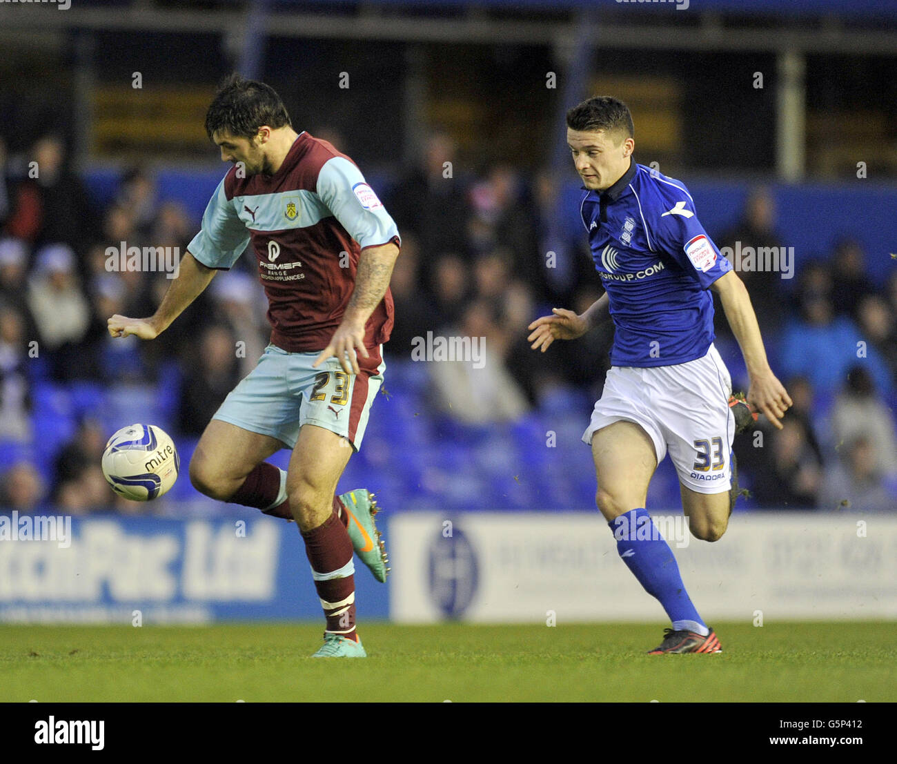 Birmingham City's Callum Reilly (right) and Burnley's Charlie Austin ...