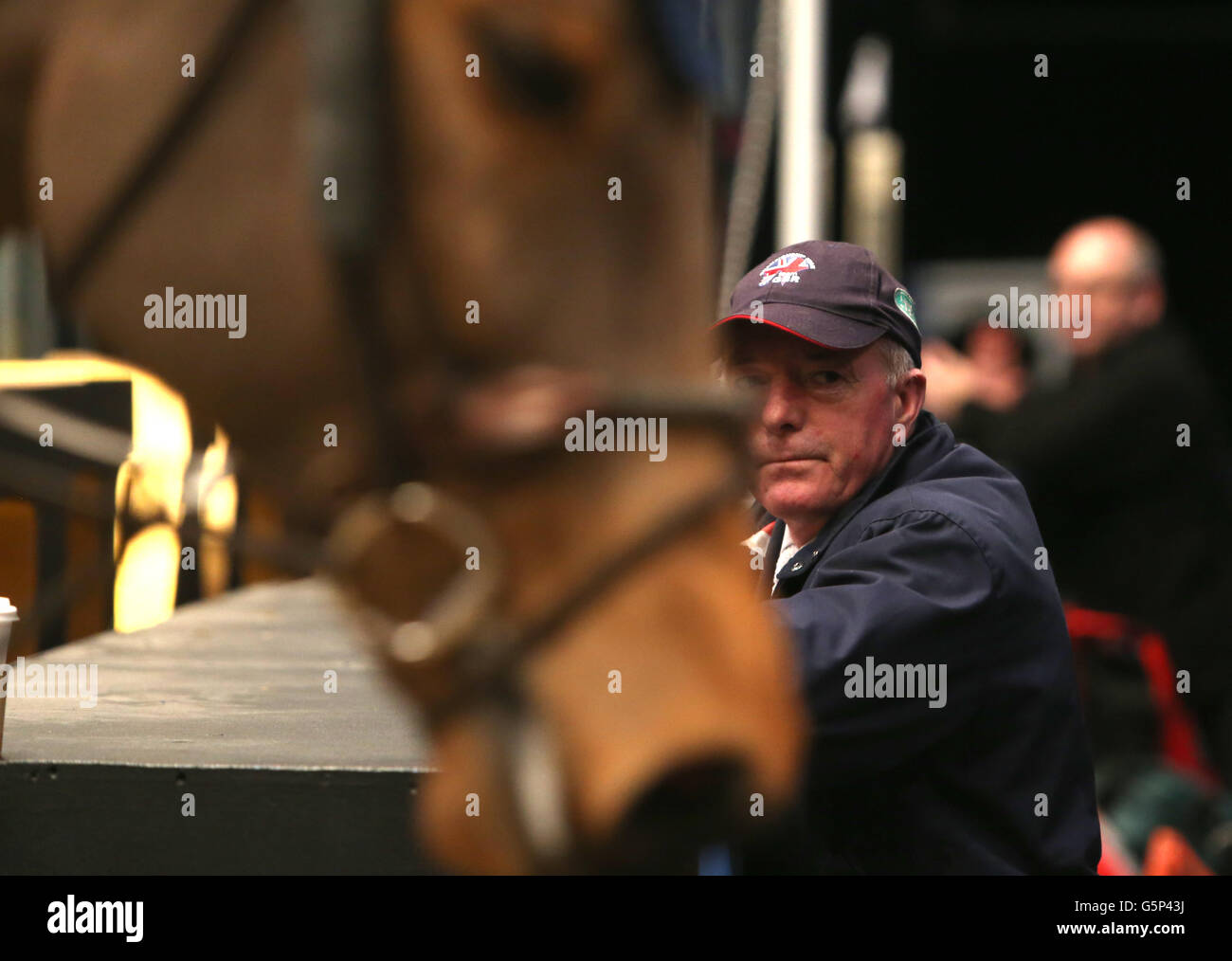 John Whitaker watches the Snowman Stakes during day seven of The London ...