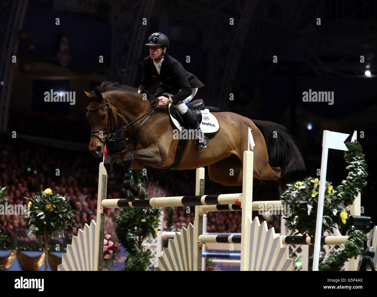 Germany's Marcus Ehning riding Sabrina wins the Olympia Grand Prix ...