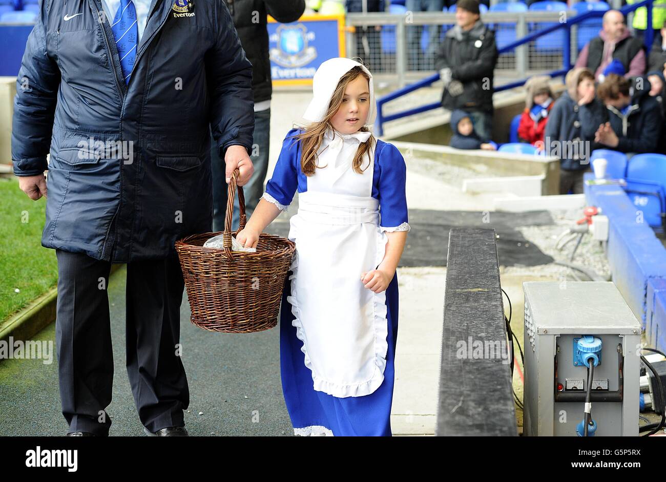 The Toffee Lady hands out sweets to kids before the game Stock Photo ...