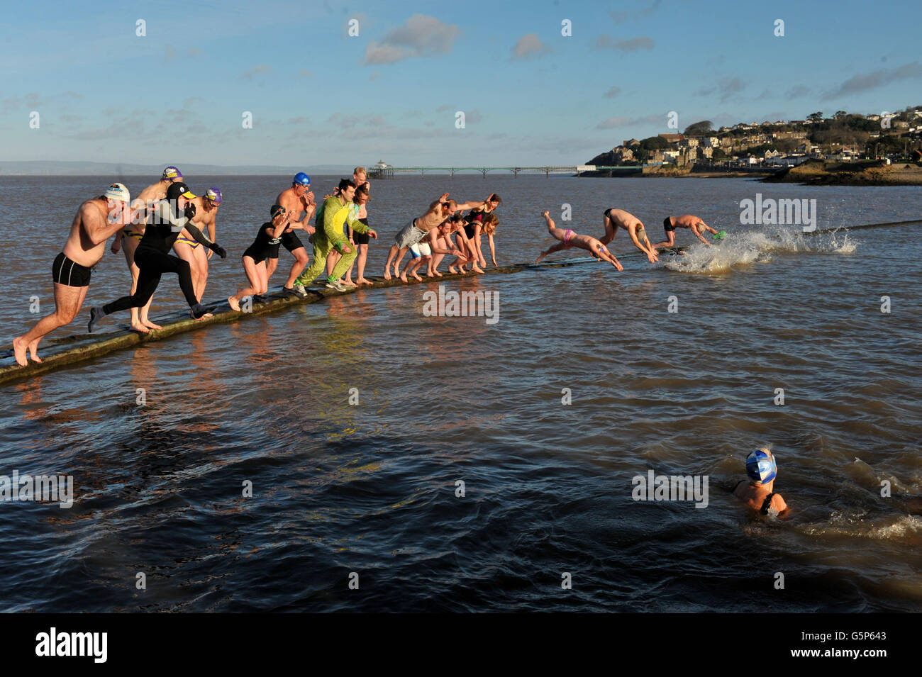 Annual New Year's Day swim in Clevedon. Swimmers dive in for the Annual ...