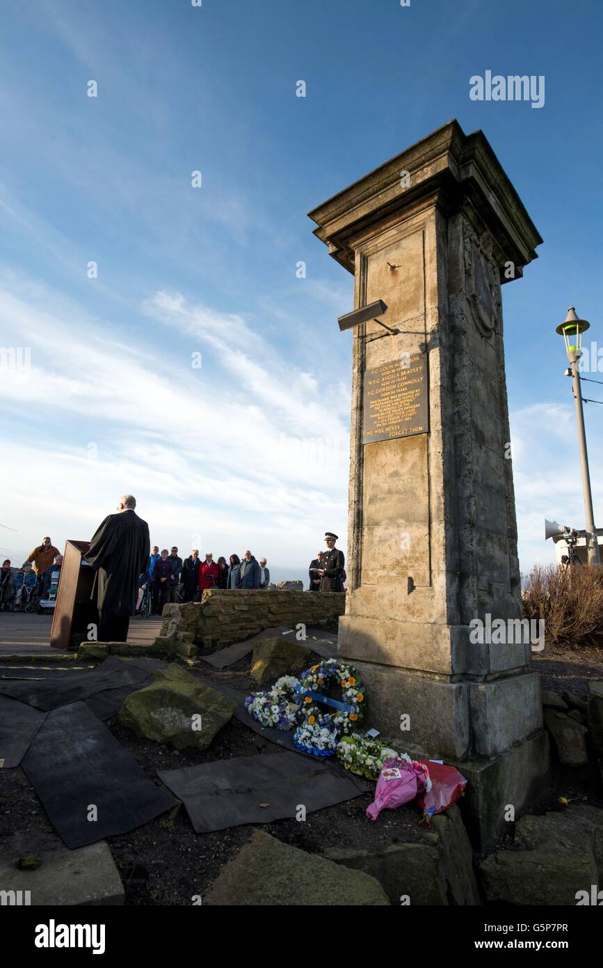 People attend the memorial service in Gynn Square, Blackpool, to mark ...