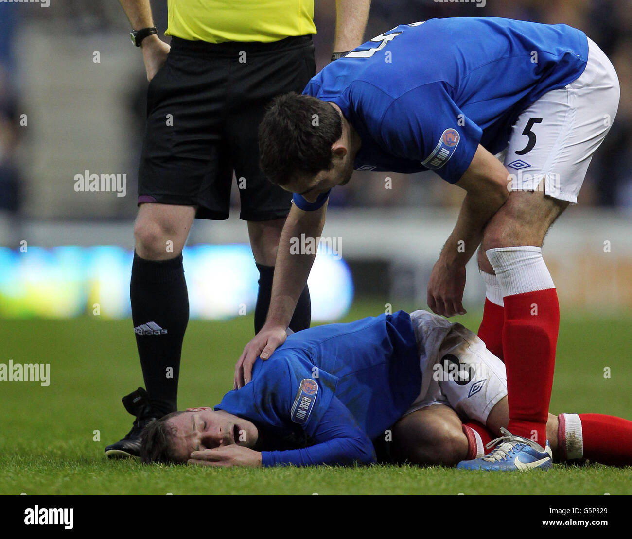 Ranger's Ian Black lays on the floor after being tackled during the Irn ...