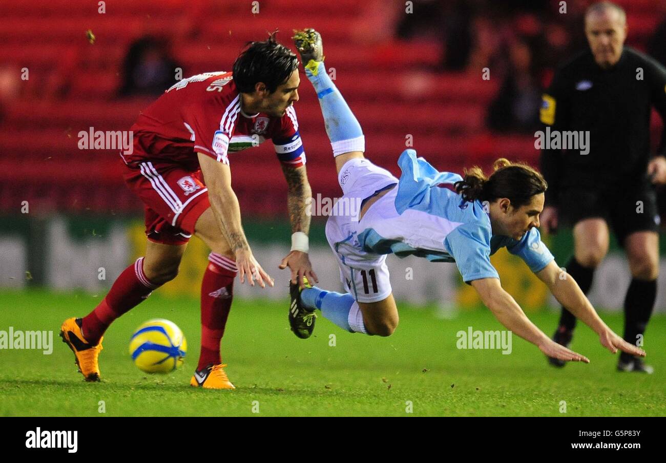 Middlesbrough's Rhys Williams (left) tackles Hastings' Bradley Goldberg ...