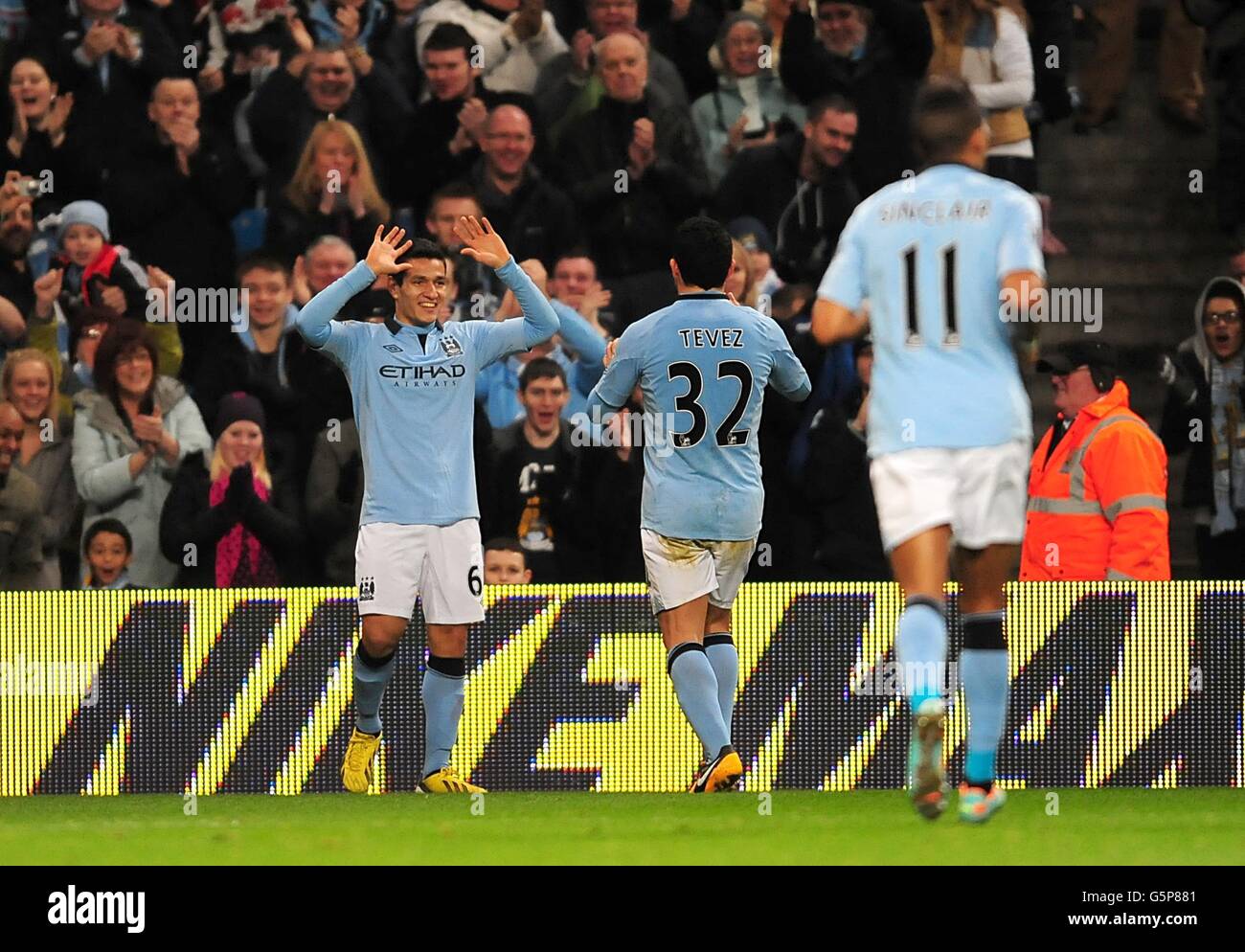 Manchester City's Marcos Lopes (left) celebrates scoring his teams ...