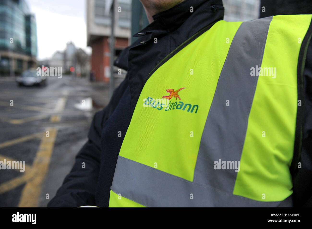 A Bus Eirann worker outside the main bus terminal Busaras. Bus Eireann ...