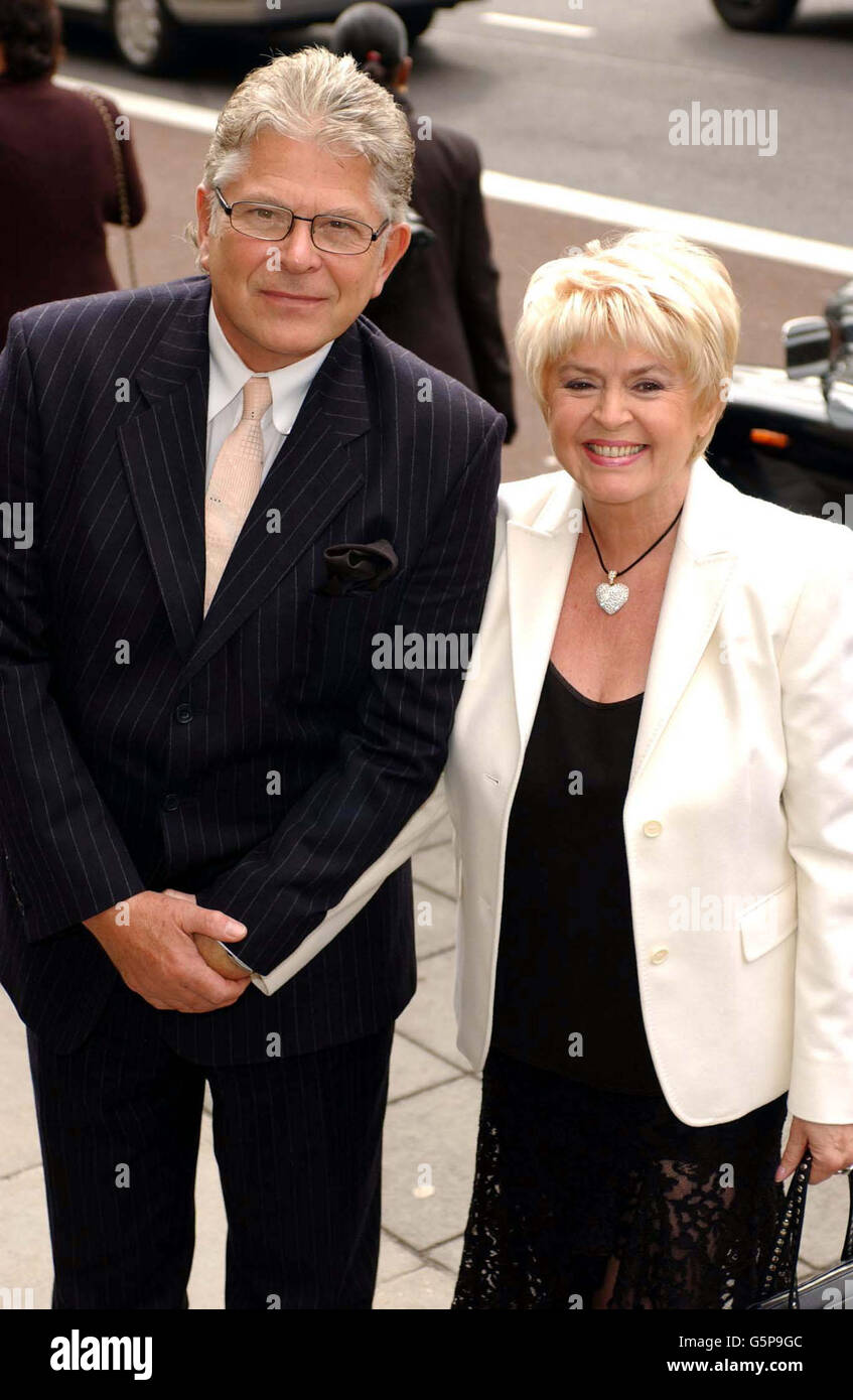 Award celebrity cream jacket black dress smiling holding hands hi-res ...